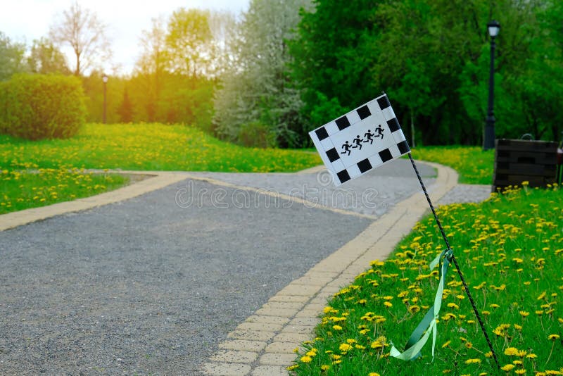 City Marathon Running Track Sign in the City Park. Flags Indicating the ...