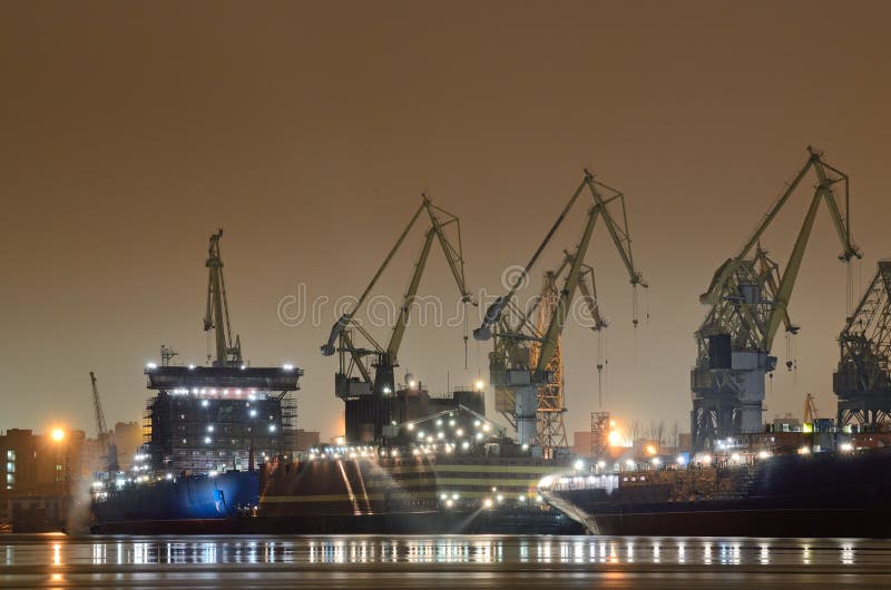 A shipyard at night stock photo. Image of store, city - 14341130