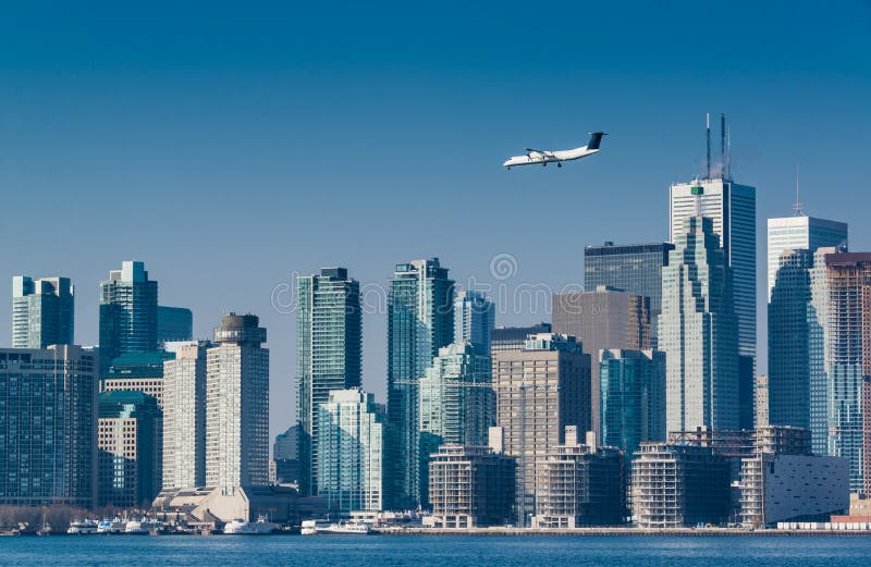 City Skyline with a Business Jet Above Stock Photo - Image of sunny ...