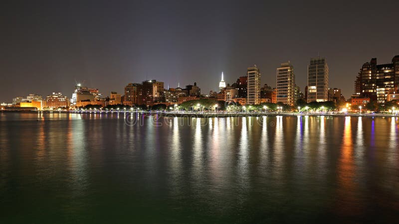 City Skyline at Night with Lit Buildings on Waterfront Stock ...