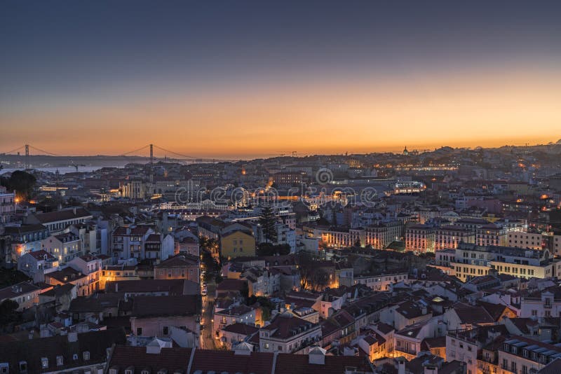 City Skyline of the Old Alfama District in Lisbon at Dusk Stock Image ...