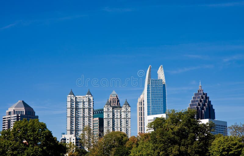 City Skyline Over Trees stock image. Image of nature, buildings - 7337093