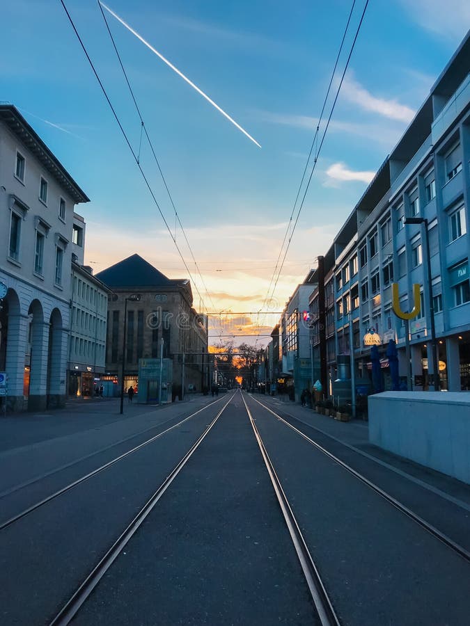 A City Street with a Train Track Running Down the Middle Stock Image ...