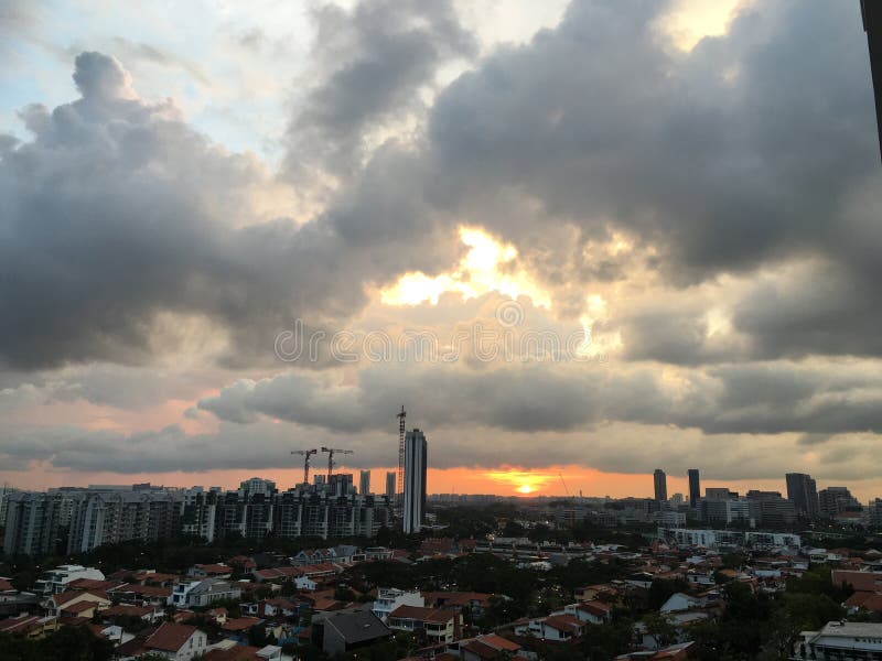 Sunset - Cloudy day stock photo. Image of sunset, city - 151273862