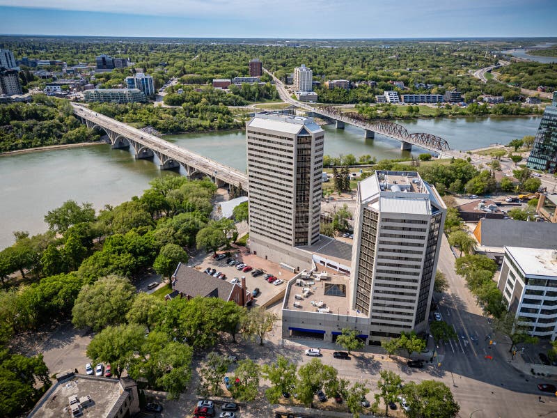 City View of a Bridge and a River with Two Tall Buildings in the ...