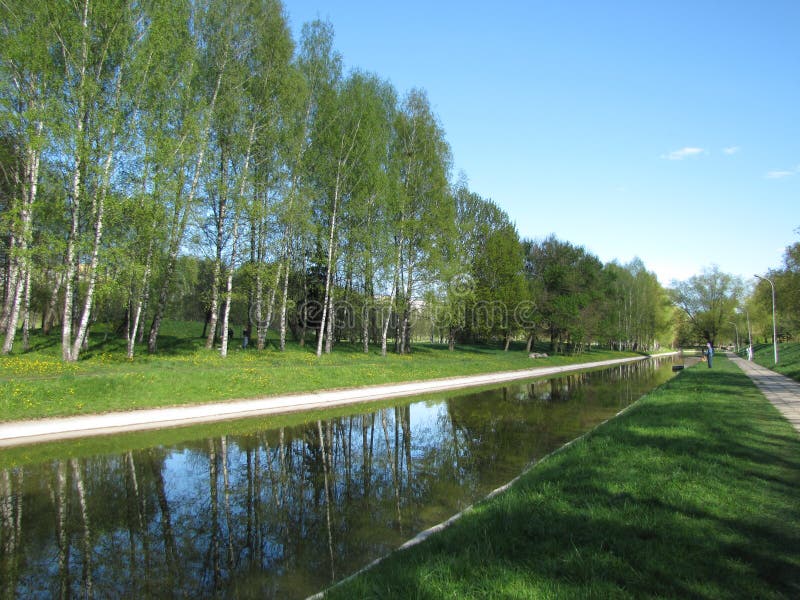 City water channel stock photo. Image of grass, pedestrians - 92588146