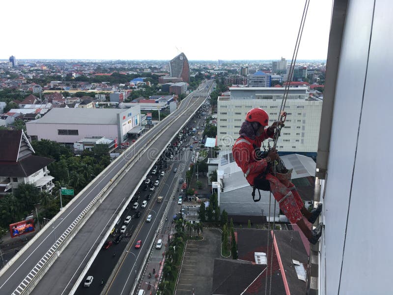 City and worker at high editorial photo. Image of workers - 266796181