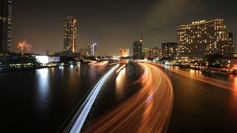 Cityscape of Light Trails on River and Firework Editorial Image - Image ...