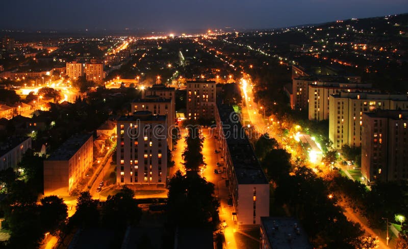 Cityscape at night stock image. Image of road, tree, town - 2389691