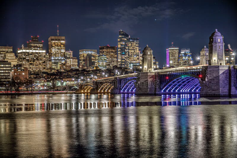 Cityscape and the Reflection of the Buildings with Lights on a River at ...