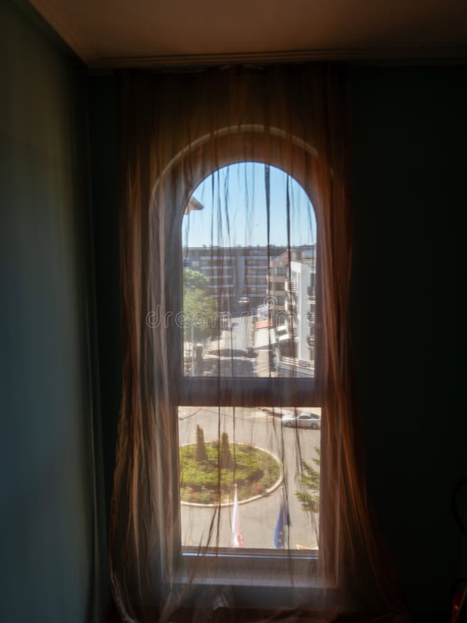 Cityscape View from Window with Sheer Curtains Flowing Stock Image ...