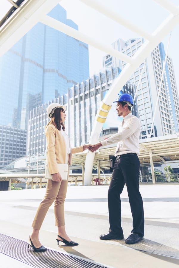 Civil Construction Engineer Teams Shaking Hands Together Wear Work ...