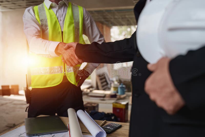 Civil Construction Team Handshake at Renovate Construction Site ...