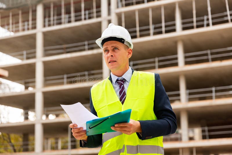 Civil Engineer Carefully Studies Work Documents Stock Image - Image of ...