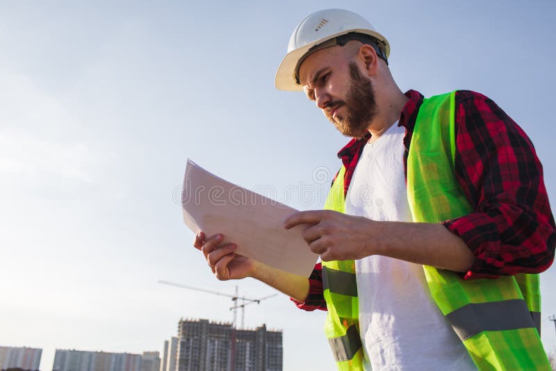 Civil Engineer Checking Work for Communication To Management Team in ...