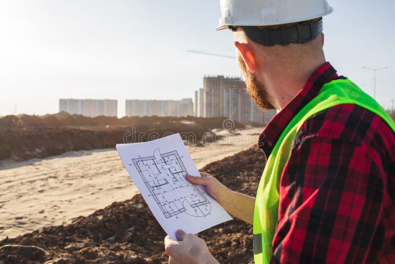 Civil Engineer Checking Work for Communication To Management Team in ...