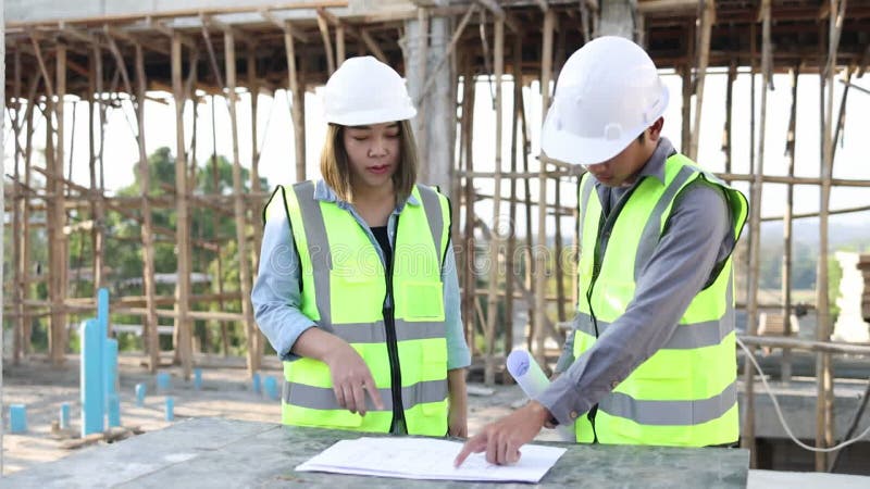 Civil Engineer and Construction Worker Manager Holding Digital Tablet ...