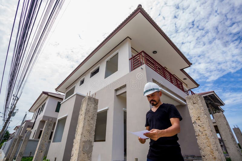 Civil Engineer or Foreman Holding White Paper with at House Building ...