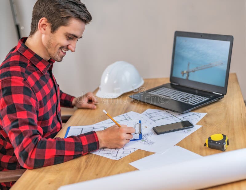 Civil Engineer at His Desk Working with Documents Stock Image - Image ...