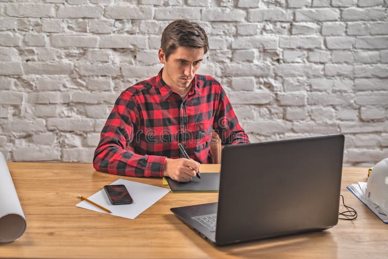 Civil Engineer at His Desk Working with Documents Stock Photo - Image ...