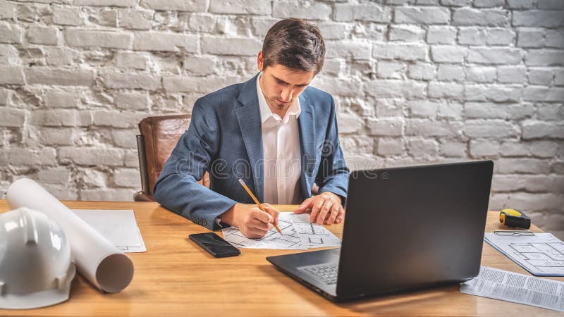Civil Engineer at His Desk Working with Documents Stock Image - Image ...