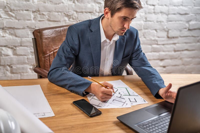 Civil Engineer at His Desk Working with Documents Stock Image - Image ...