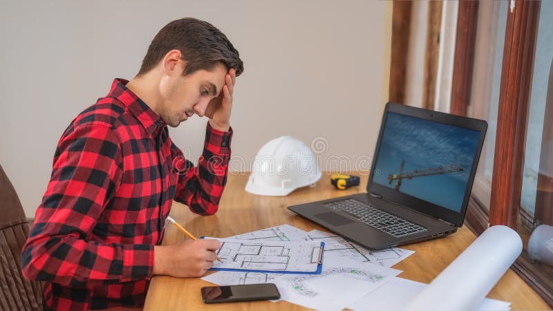 Civil Engineer at His Desk Working with Documents Stock Image - Image ...