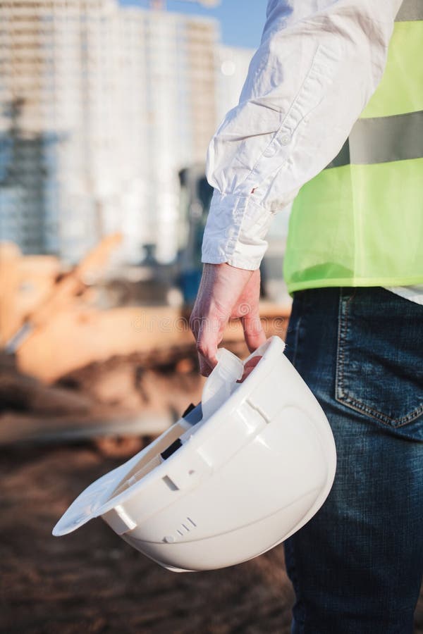 A Civil Engineer Holds a Helmet in His Hand Stock Photo - Image of ...