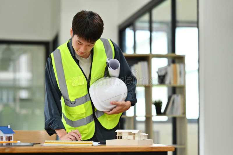 Civil Engineer Man Hardhat and Reviewing Blueprints, Working on Sketch ...