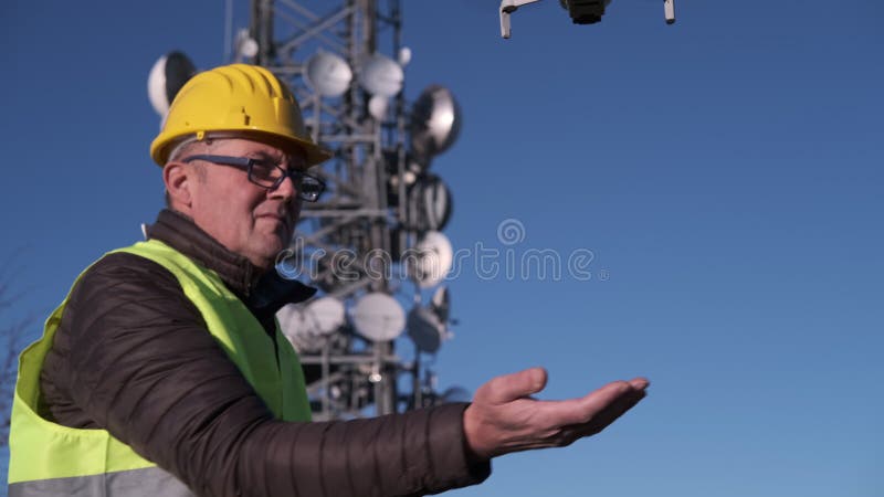 Civil Engineer Operating a Drone with Remote Control Lands the Drone at ...