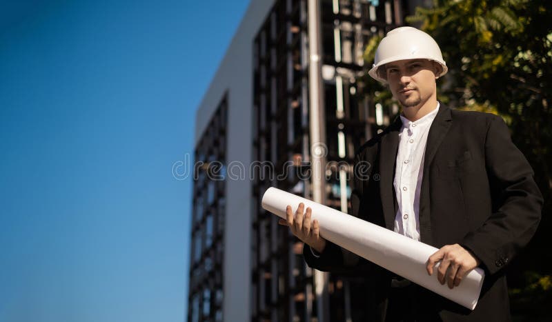 Civil Engineer Using a Tablet, Planning a Project, Builds a Modern ...