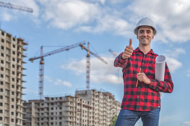 Civil Engineer in a White Helmet on the Background of Construction ...