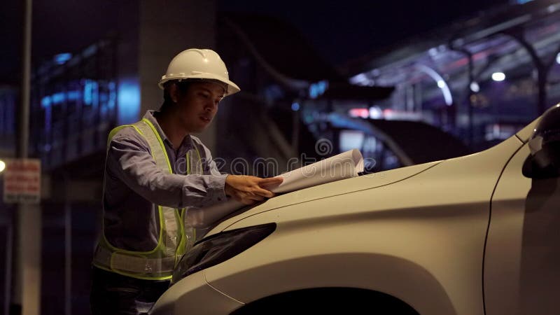 Civil Engineer Work Inspecting Architect Drawing on Construction Site ...