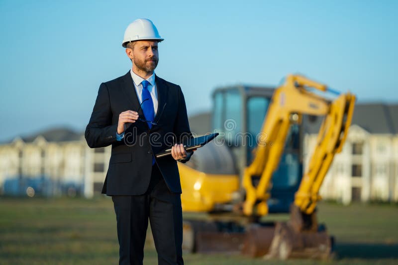 Civil Engineer Worker at a Construction Site. Mature Engineer Worker ...