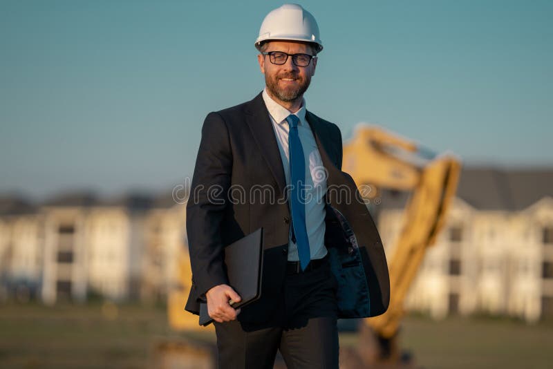 Civil Engineer Worker at a Construction Site. Mature Engineer Worker ...