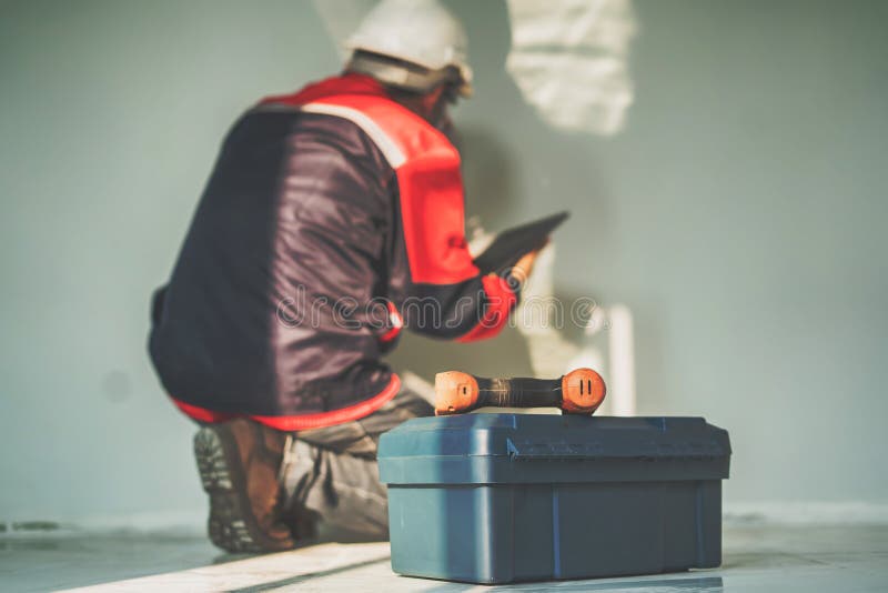 Civil Engineer Working with Toolbox and Drill Bit in Home Interior ...