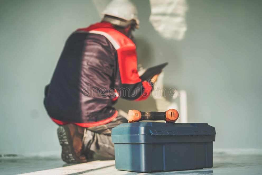 Civil Engineer Working with Toolbox and Drill Bit in Home Interior ...