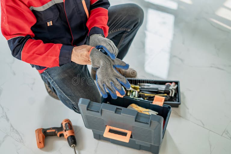 Civil Engineer Working with Toolbox and Drill Bit in Home Interior ...