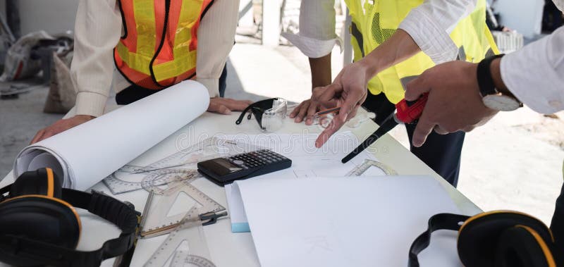 Civil Engineering Team Meets To Plan Work on Construction Project in ...