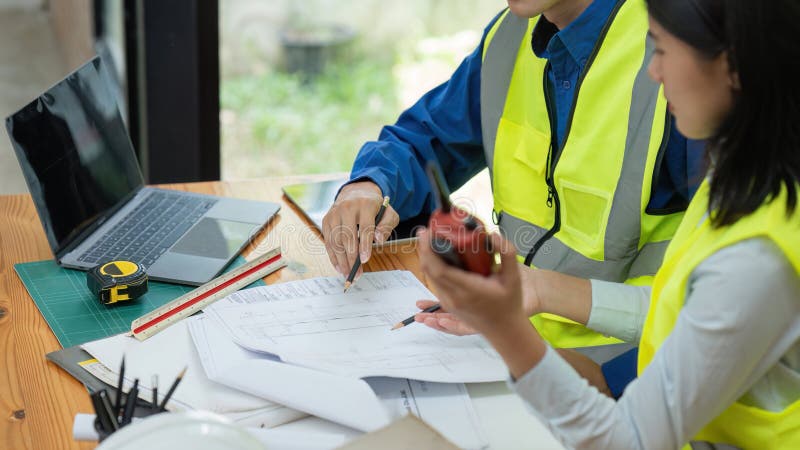 Civil Engineers and Architects Discuss Project Construction Together at ...