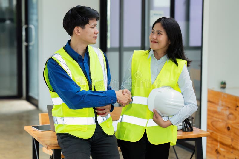 Civil Engineers and Architects Handshake after Work Done at the Office ...