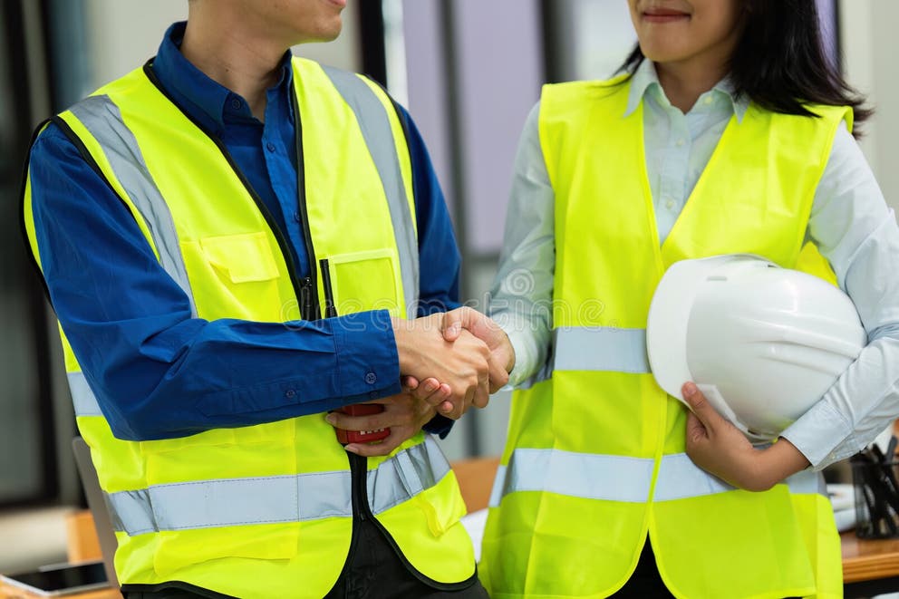 Civil Engineers and Architects Handshake after Work Done at the Office ...