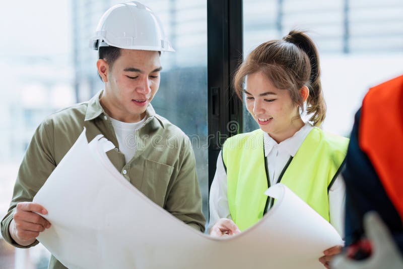 Civil Engineers Architects Inspecting Working Building Site Blueprints ...