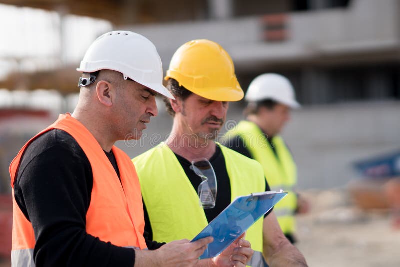 Coworkers on Construction Site Stock Image - Image of clothing, male ...