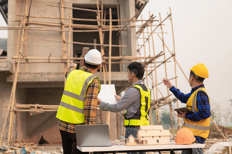 Civil Engineers Inspect Work with Walkie-talkies for Communicating with ...