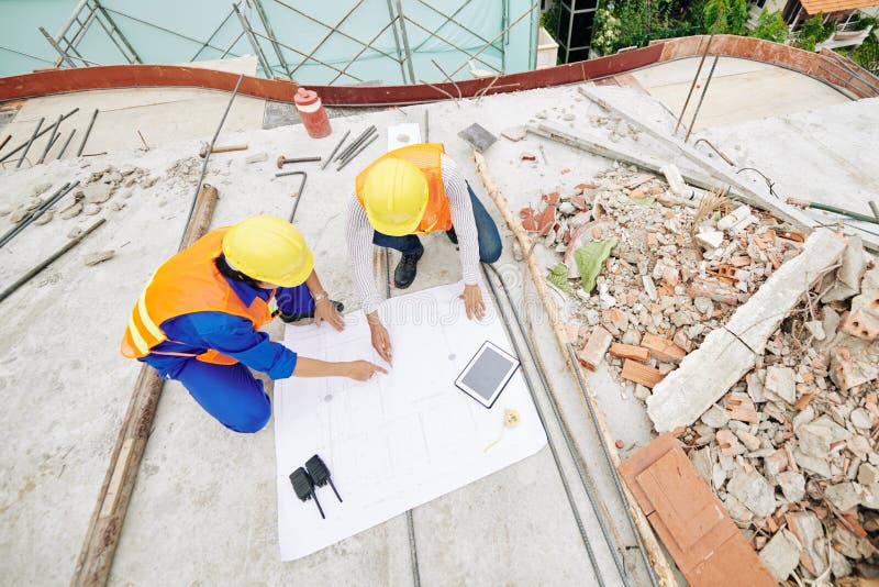 Civil Engineers Pointing at a House Stock Image - Image of female ...