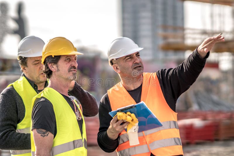 Civil Engineers at Work on Construction Site Stock Photo - Image of ...
