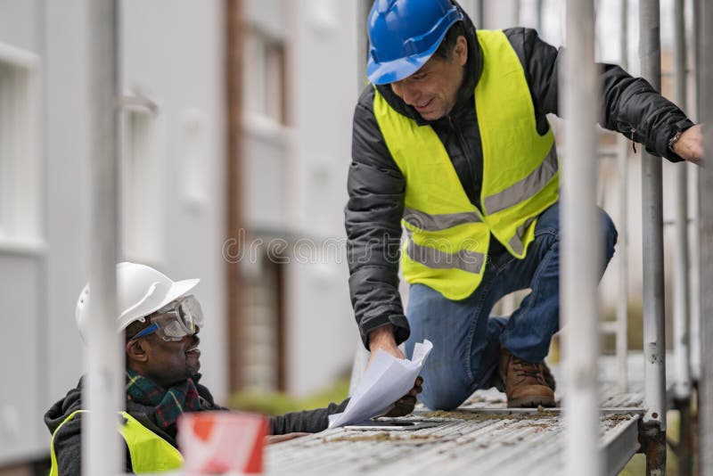 Engineers and Construction Workers at Work Stock Photo - Image of ...
