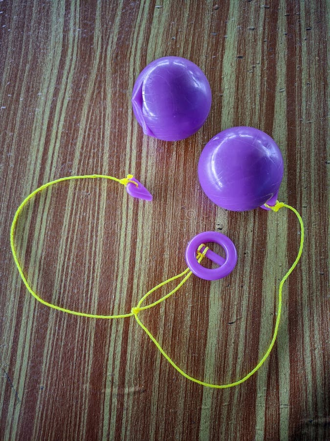 The Purple Clackers Ball Shatters on the Hook of the String Stock Image ...