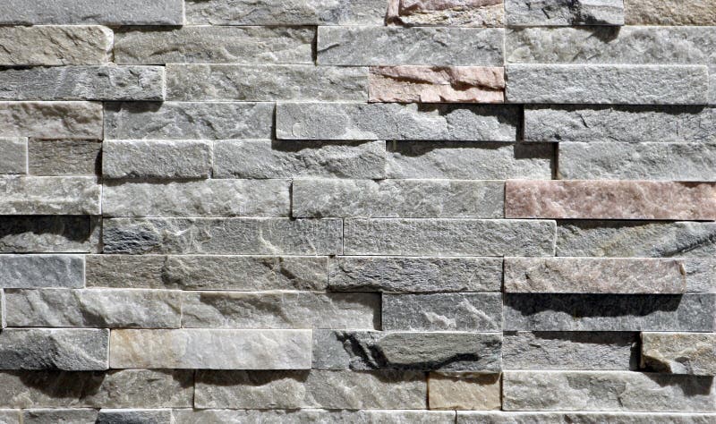 Cladding Wall Made of Small Uneven Stone Bricks, Predominantly Gray ...